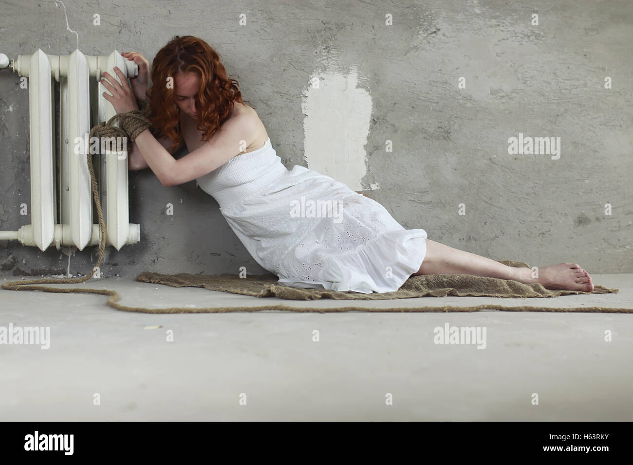 girl hands bound prisoner Stock Photo - Alamy