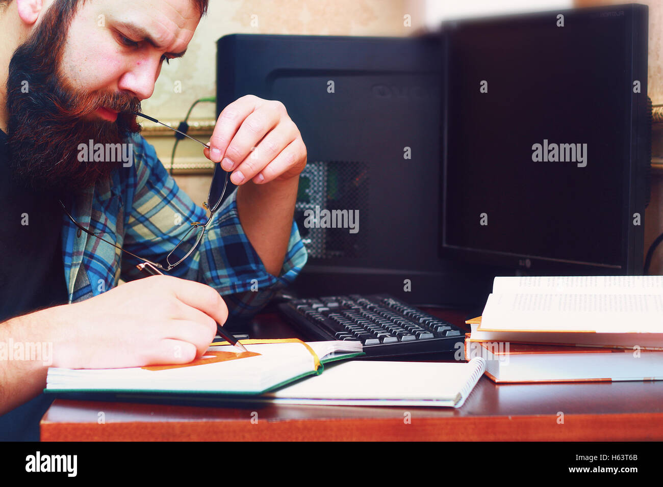 male work computer pen write Stock Photo - Alamy