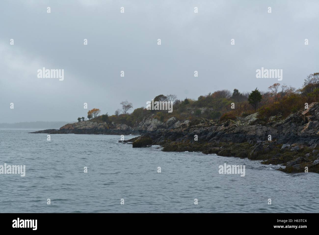 The rocky shoreline of Misery island and ruins in Salem Harbor, north ...