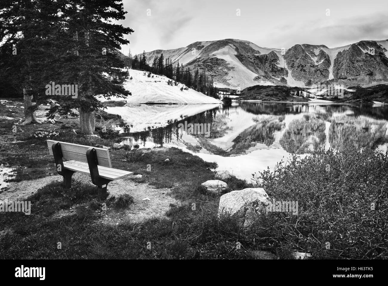 Bench on the lake in Snowy Range Mountains in Medicine Bow, Wyoming in ...