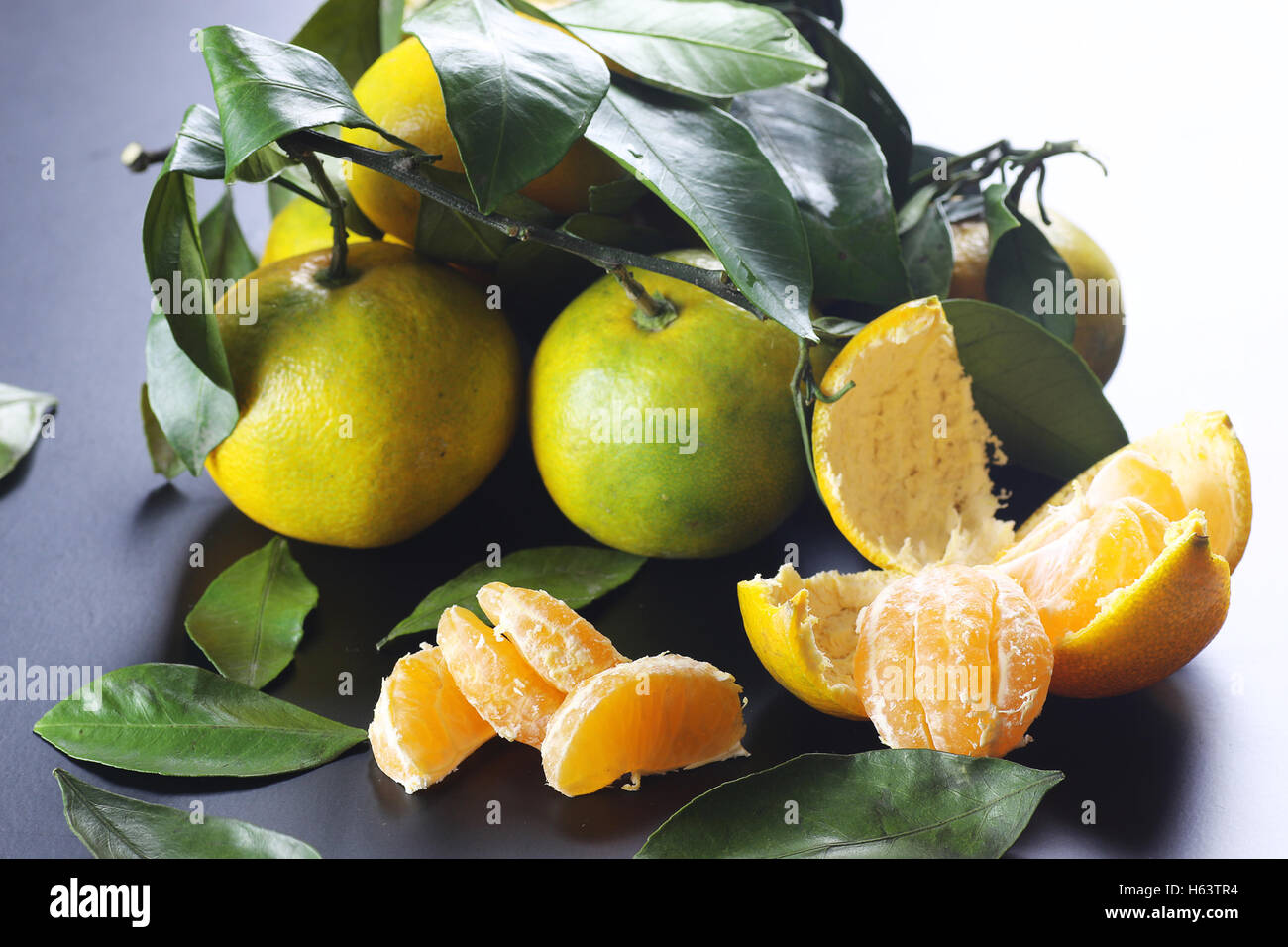 mandarin fruit isolate black Stock Photo - Alamy