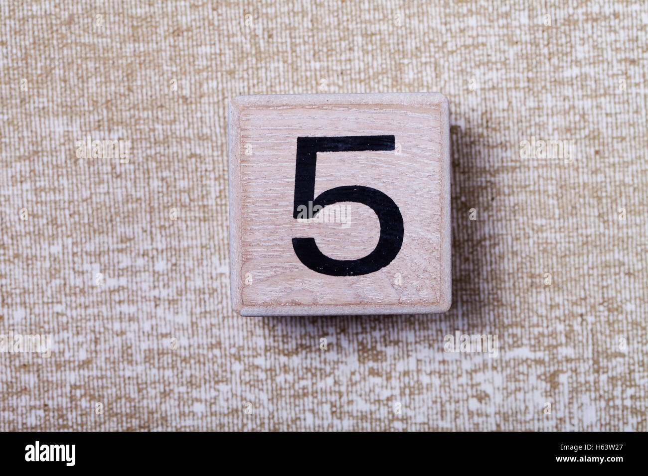 a set of figures on wooden cubes 5 Stock Photo - Alamy