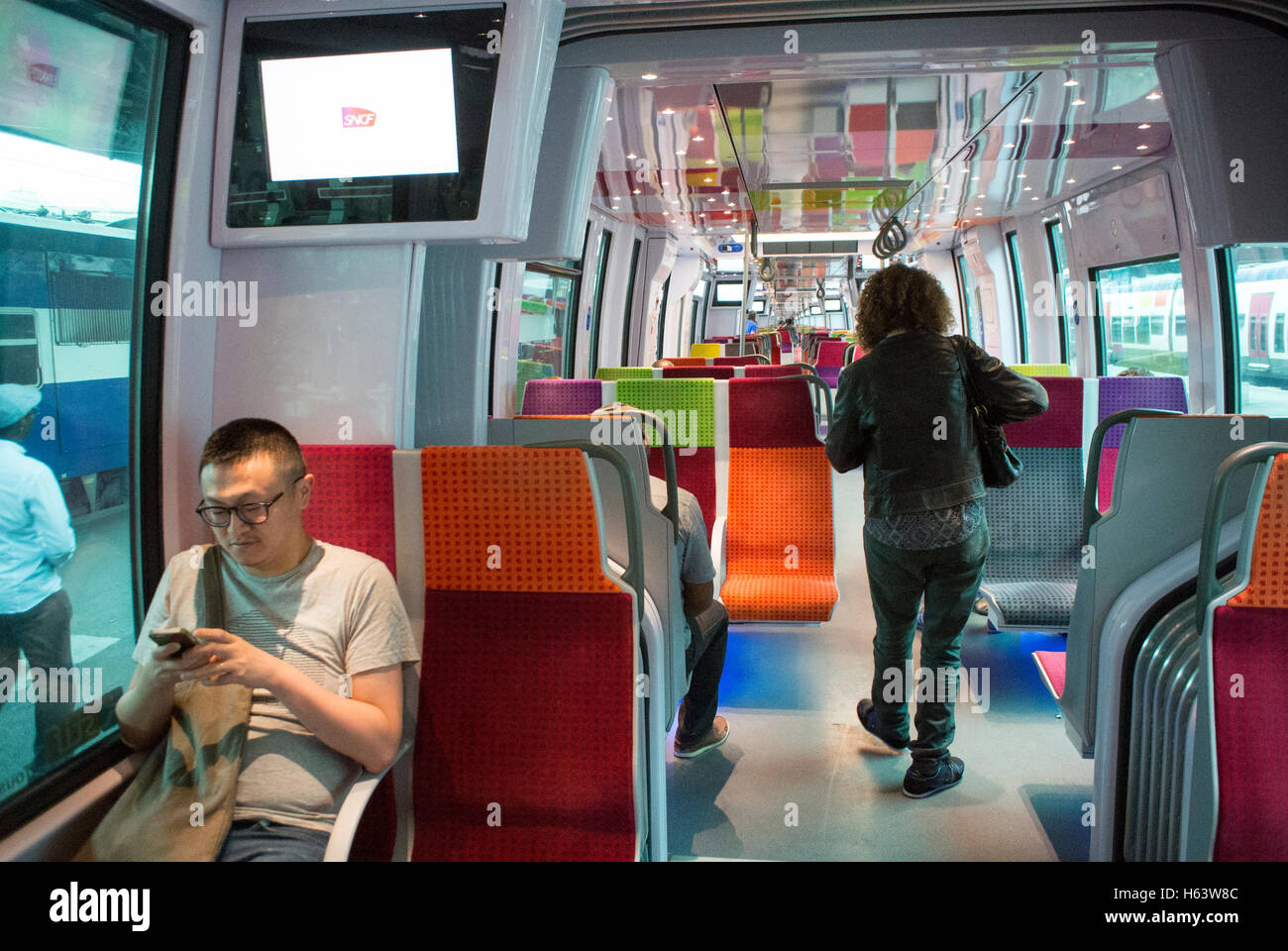 Paris, France, Chinese Man Sitting, Riding Alone on RER A Subway Train ...