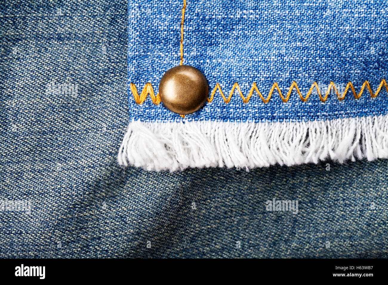 a Jeans rivet seam closeup Stock Photo - Alamy