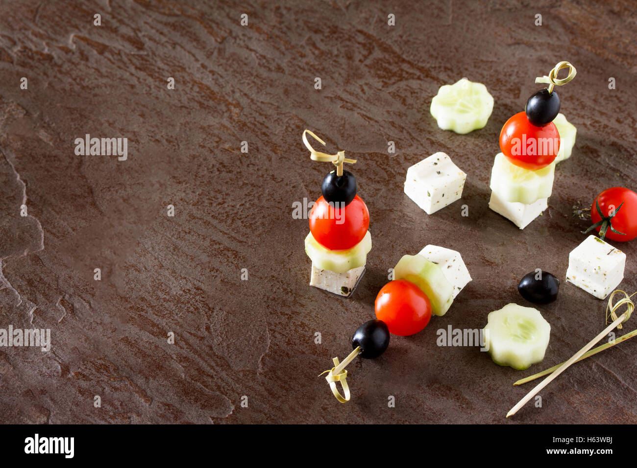Appetizer canape. Greek salad with fresh vegetables, feta cheese and ...