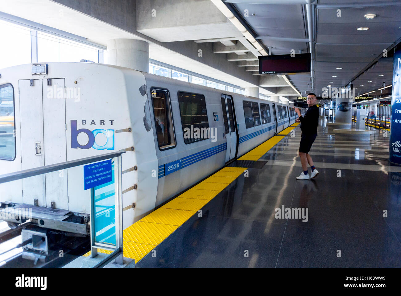 San Francisco, CA, USA, Chinese Man standing alone in empty train BART ...