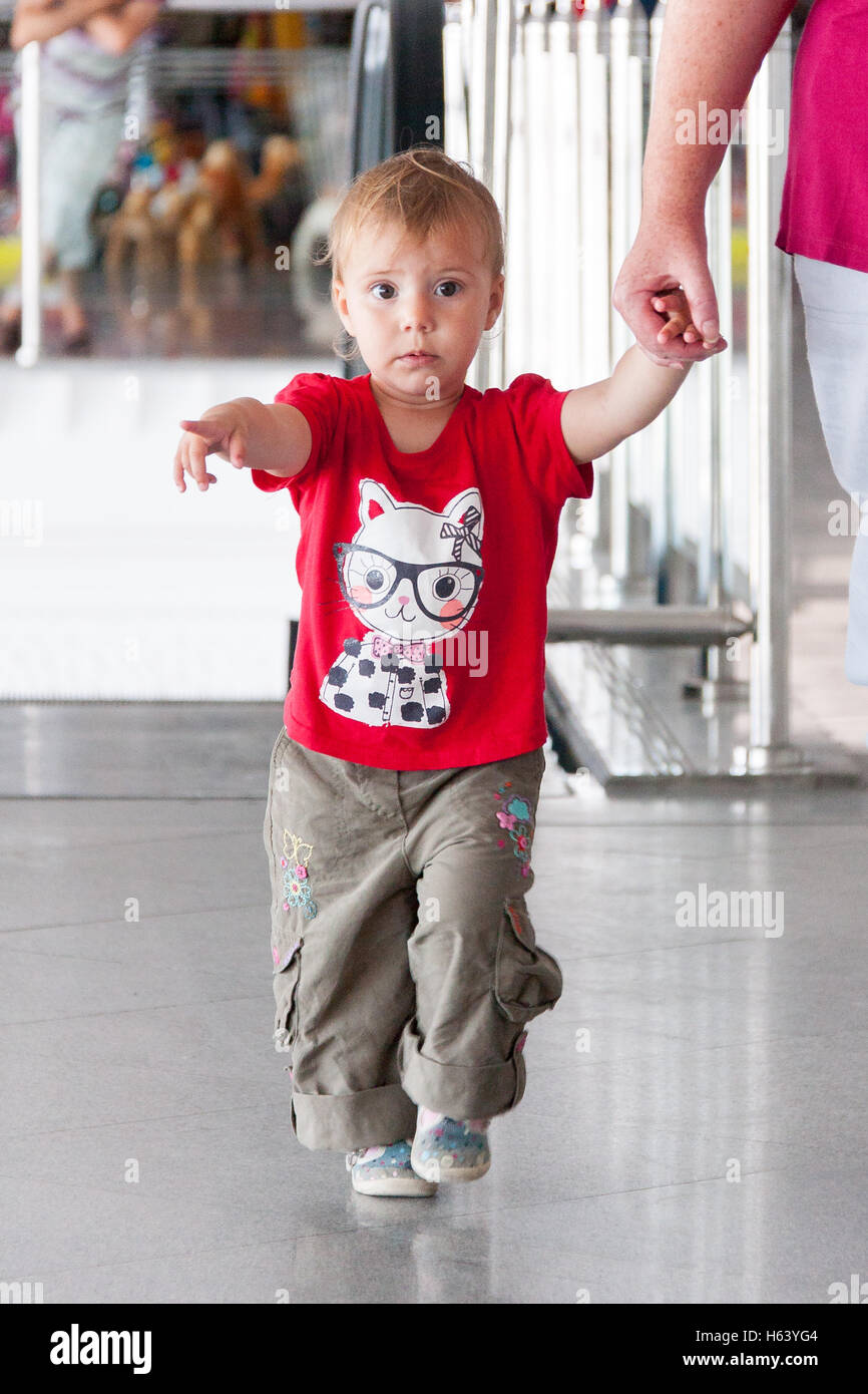 young girl holding adults hand and pointing Stock Photo - Alamy