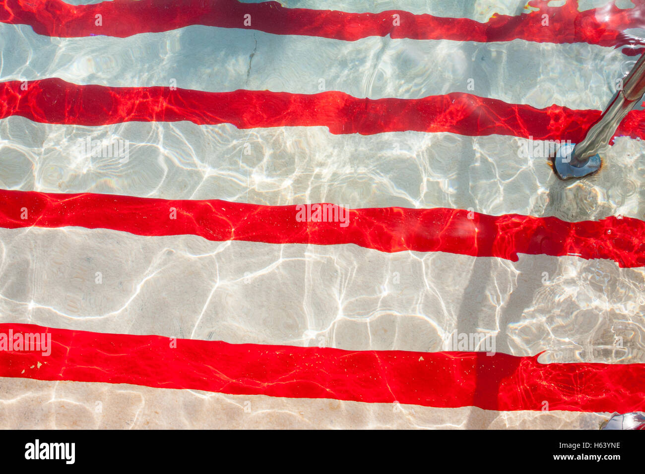 red and white striped swimming pool steps Stock Photo - Alamy