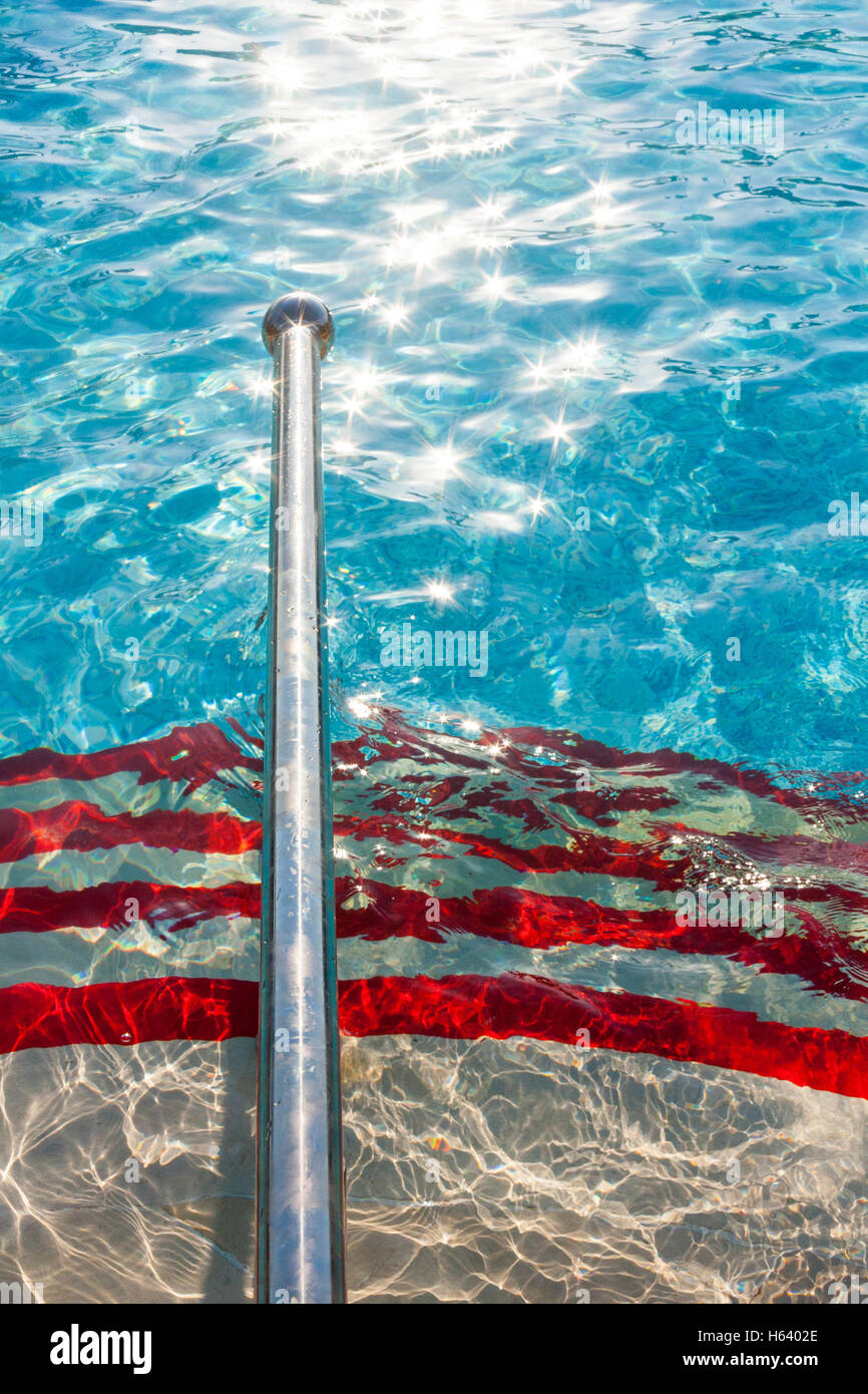 red and white striped swimming pool steps Stock Photo - Alamy