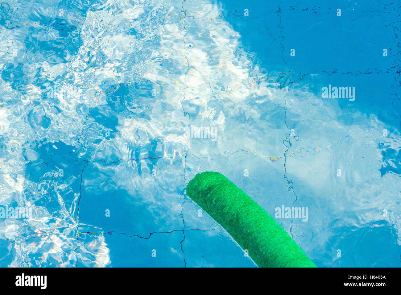 end of green woggle in swimming pool close up Stock Photo - Alamy