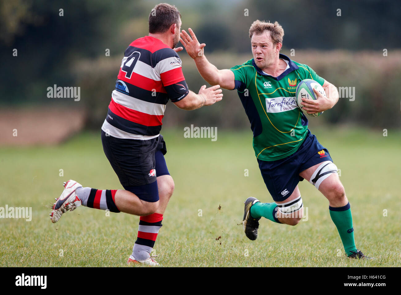 Action tackle hand off hi-res stock photography and images - Alamy