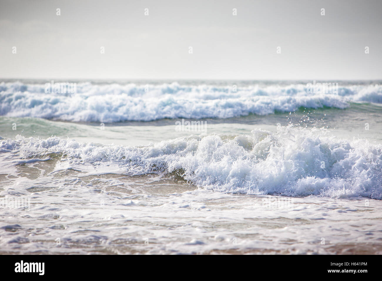 waves of the sea breaking on the beach Stock Photo - Alamy