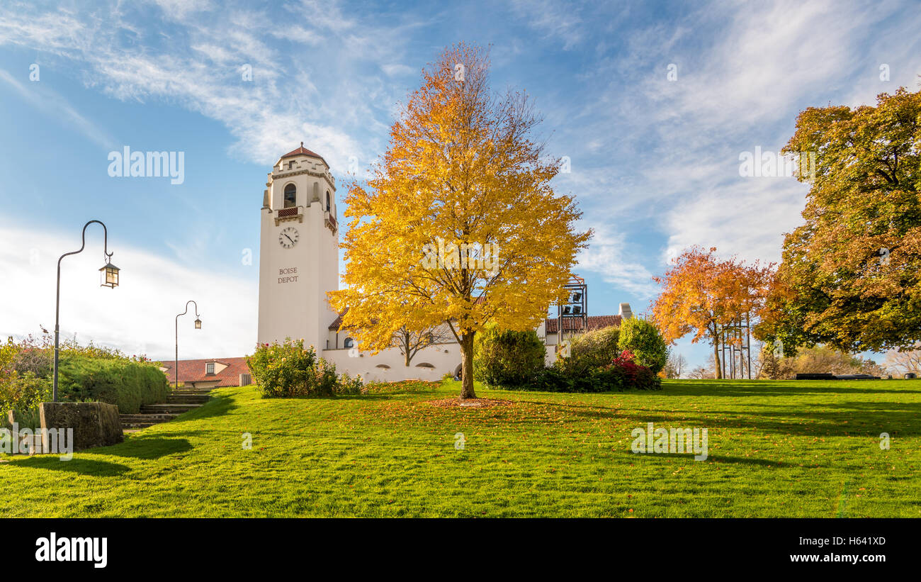 Train depot with fall colors and blue cloudy sky Stock Photo - Alamy