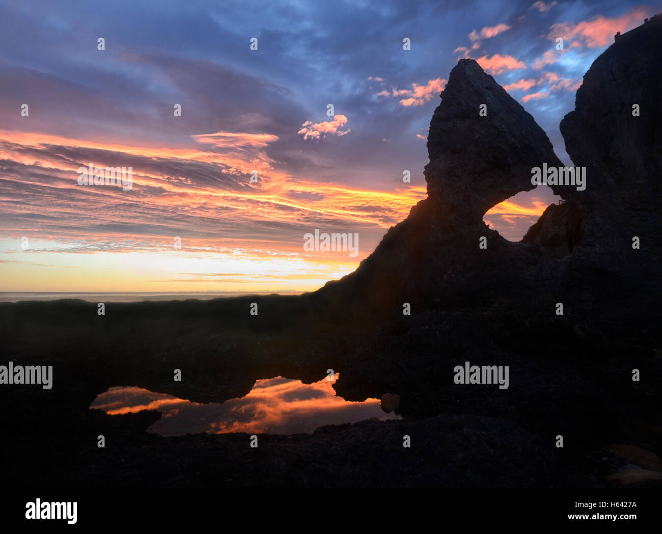 View of iconic Australia Rock at sunrise and low tide, Narooma, New ...