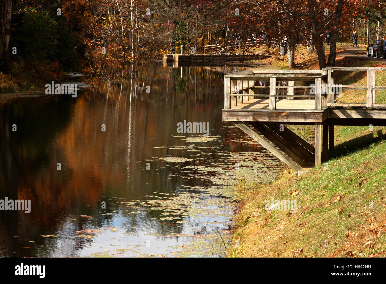 Decks at small lake in autumn Stock Photo - Alamy