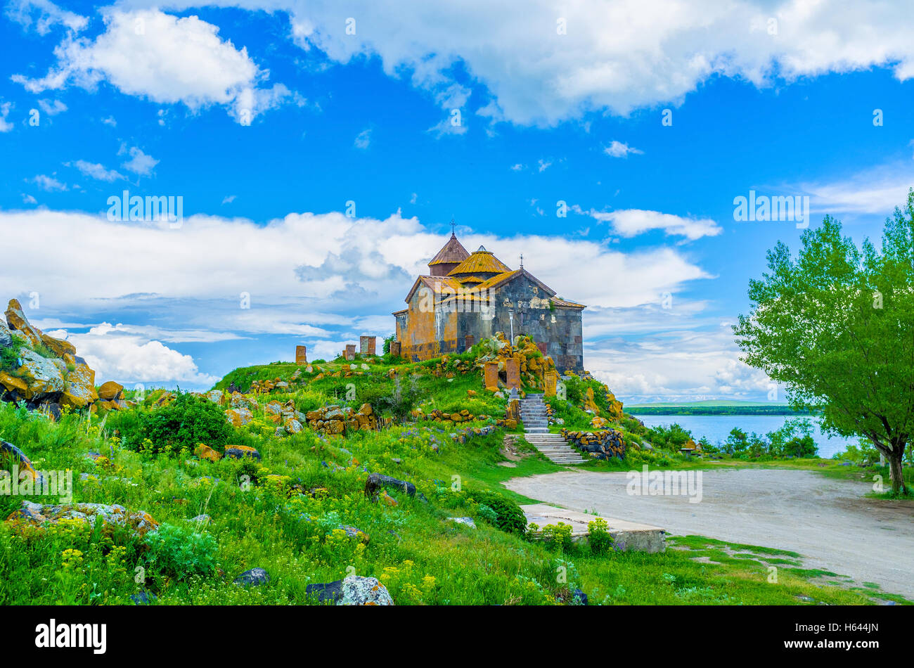 The stone church of Hayravank Monastery covered with bright orange ...