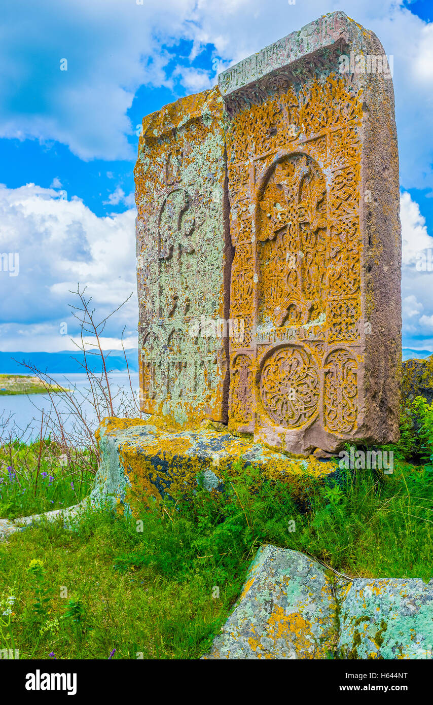 The khachkars are traditional Armenian cross-stones with complex floral ...