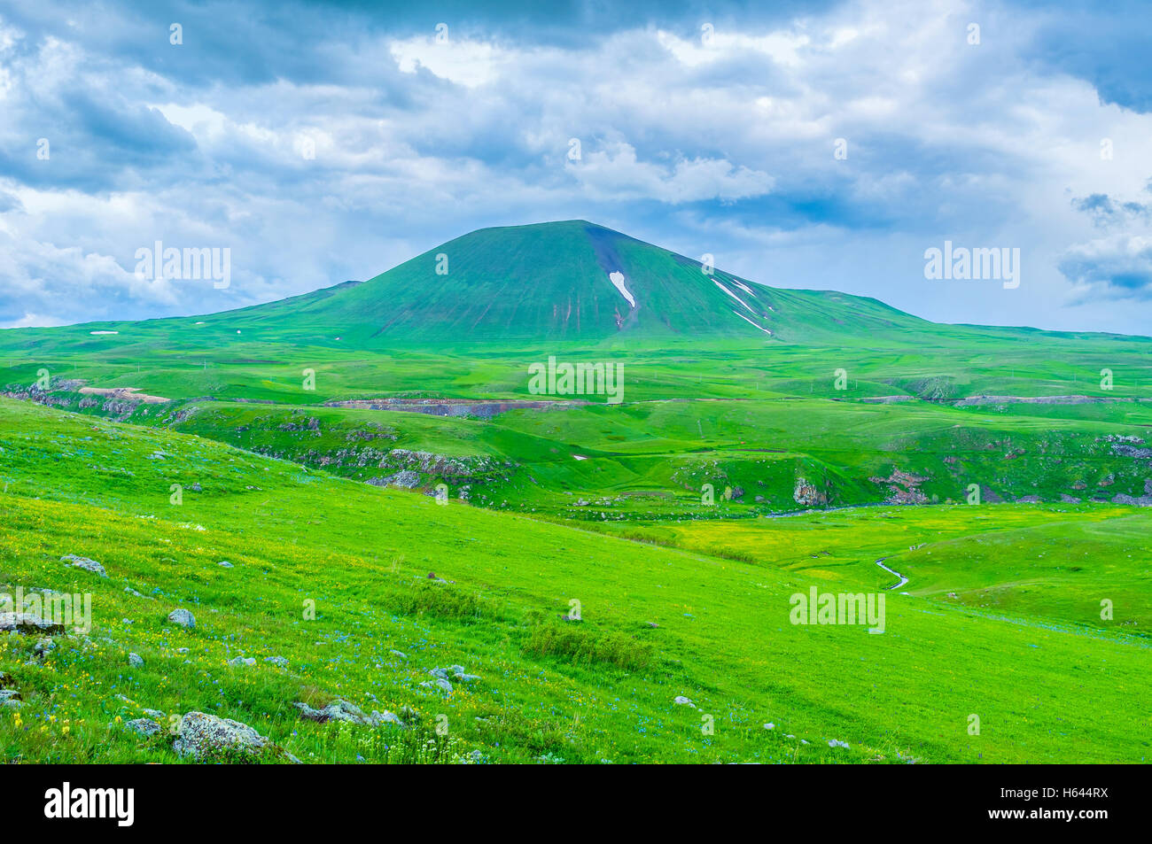 The ancient volcano along the Selim pass, covered with green meadows ...