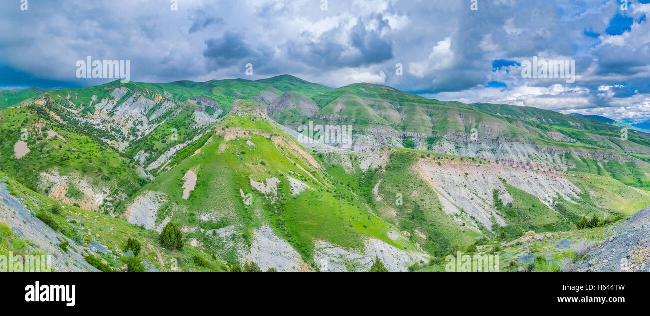 Panorama of Geghama Mountain Range covered with heavy grey clouds ...