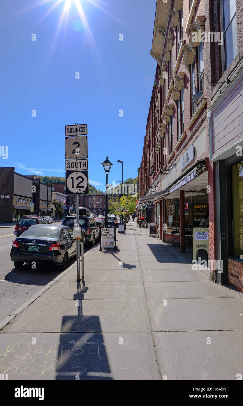 Typical street view in a US town showing shops and parking areas on a ...