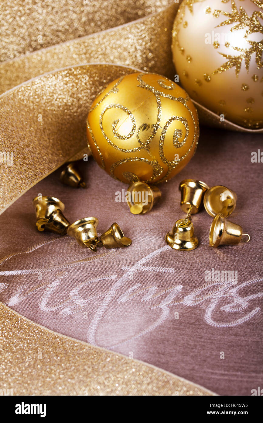 Festive gold Christmas decorations on a fabric background Stock Photo ...