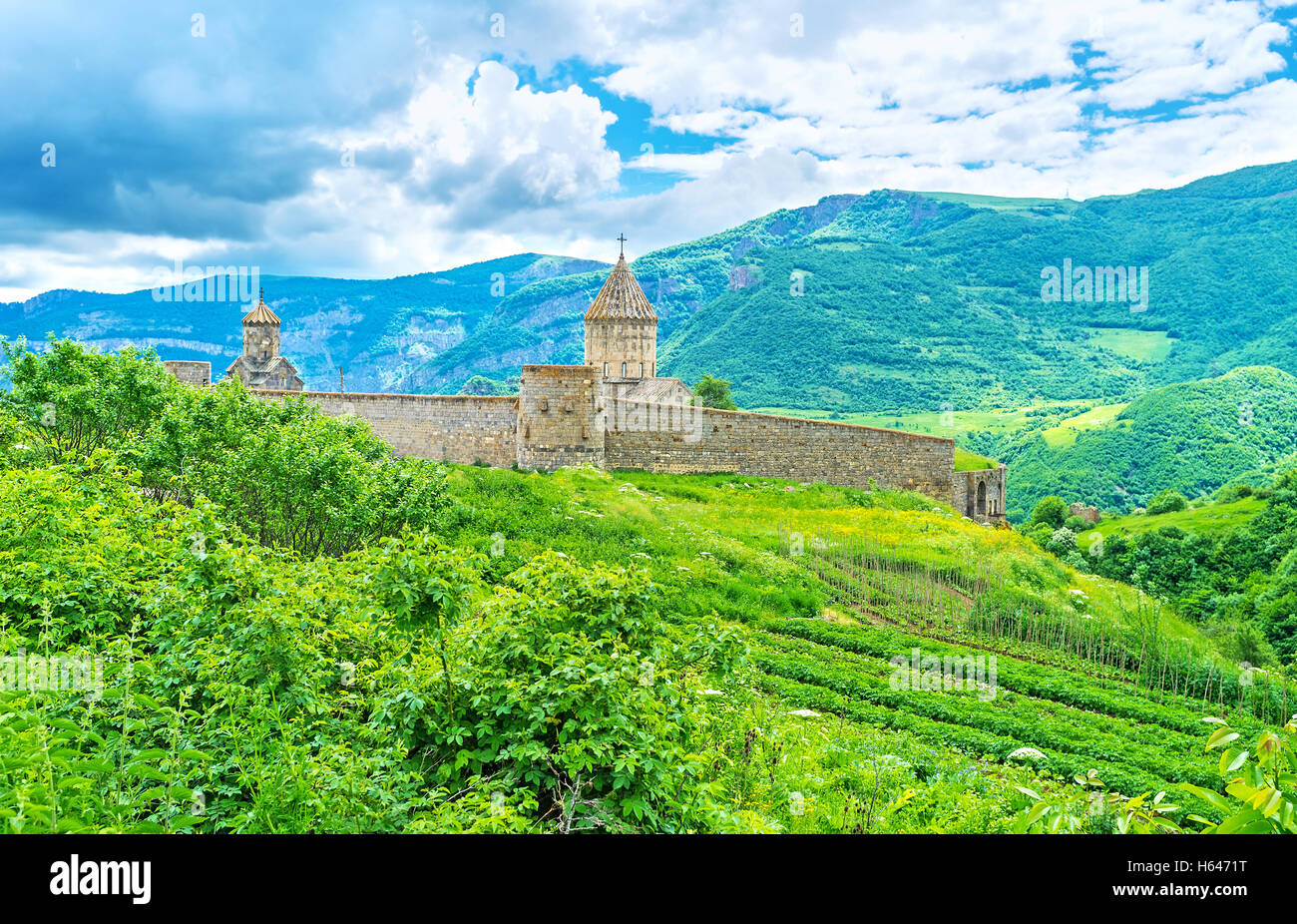 The fortified Tatev Monastery with the high stone domes, hidden behind ...
