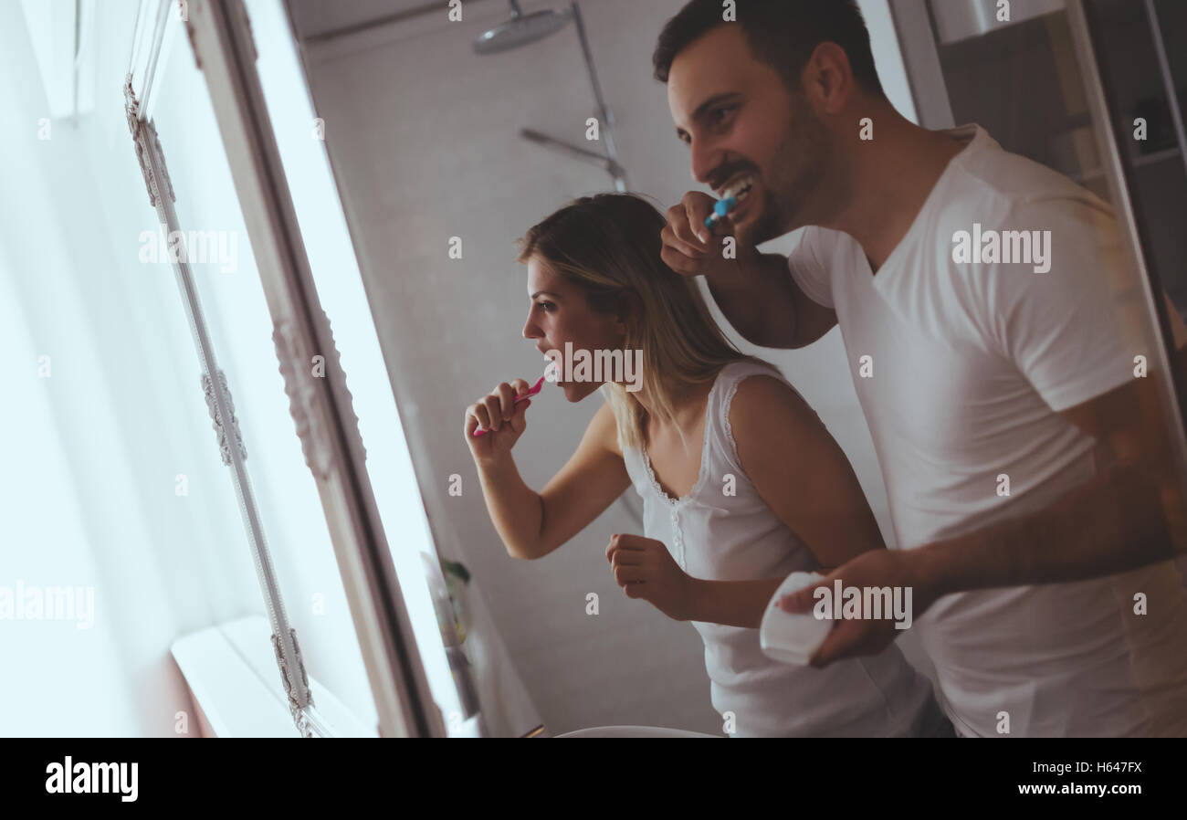 Couple washing teeth in morning, dental hygiene is important Stock ...