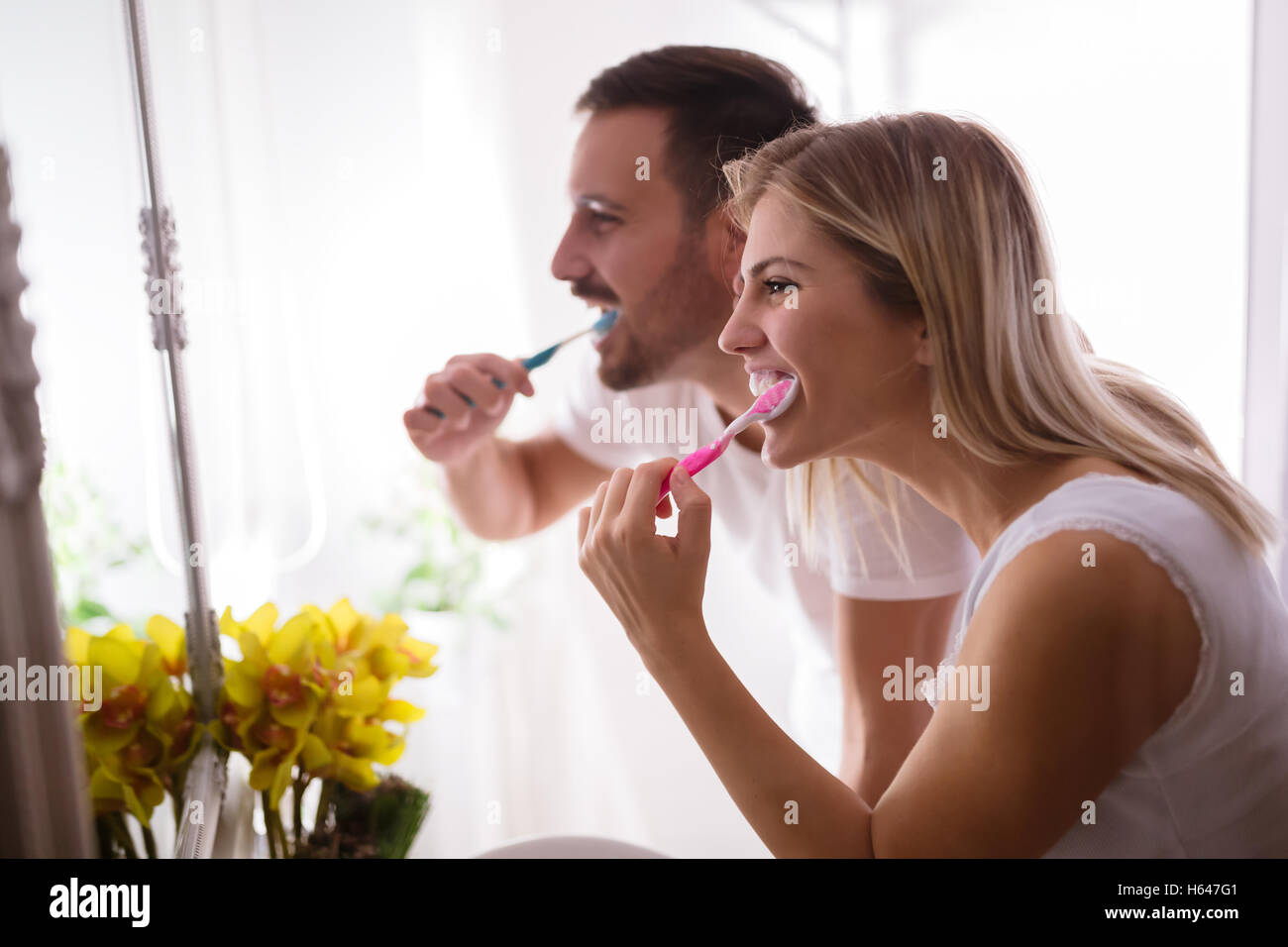 Couple washing teeth in morning, dental hygiene is important Stock ...