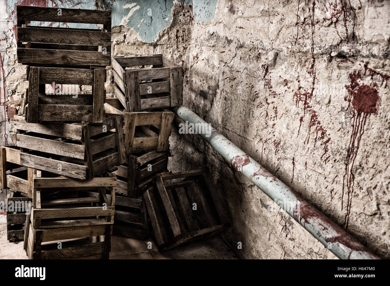 Old empty packing crates are arranged one on one in terrible basement ...