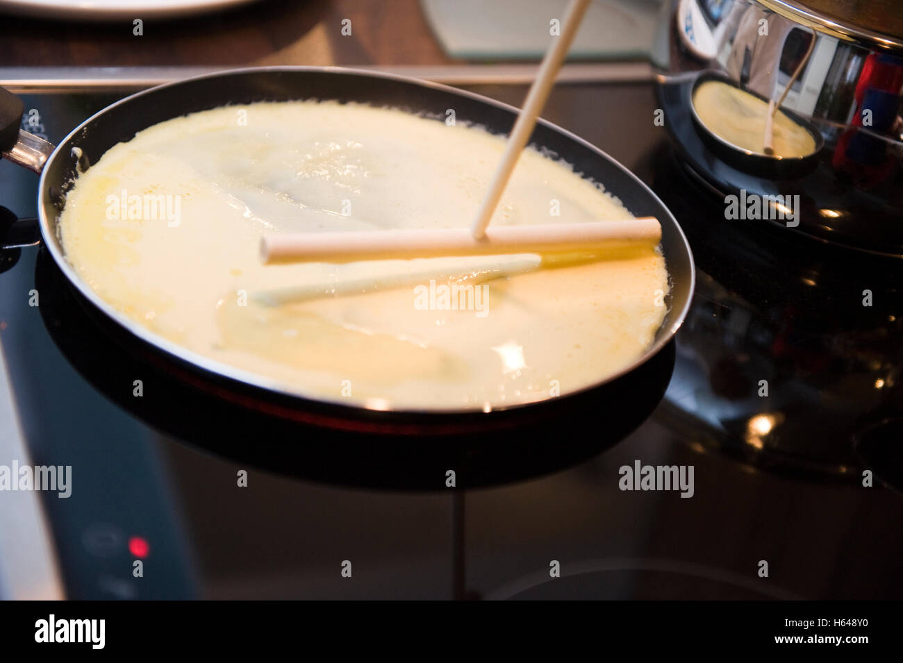 Making crepes in the pan Stock Photo - Alamy