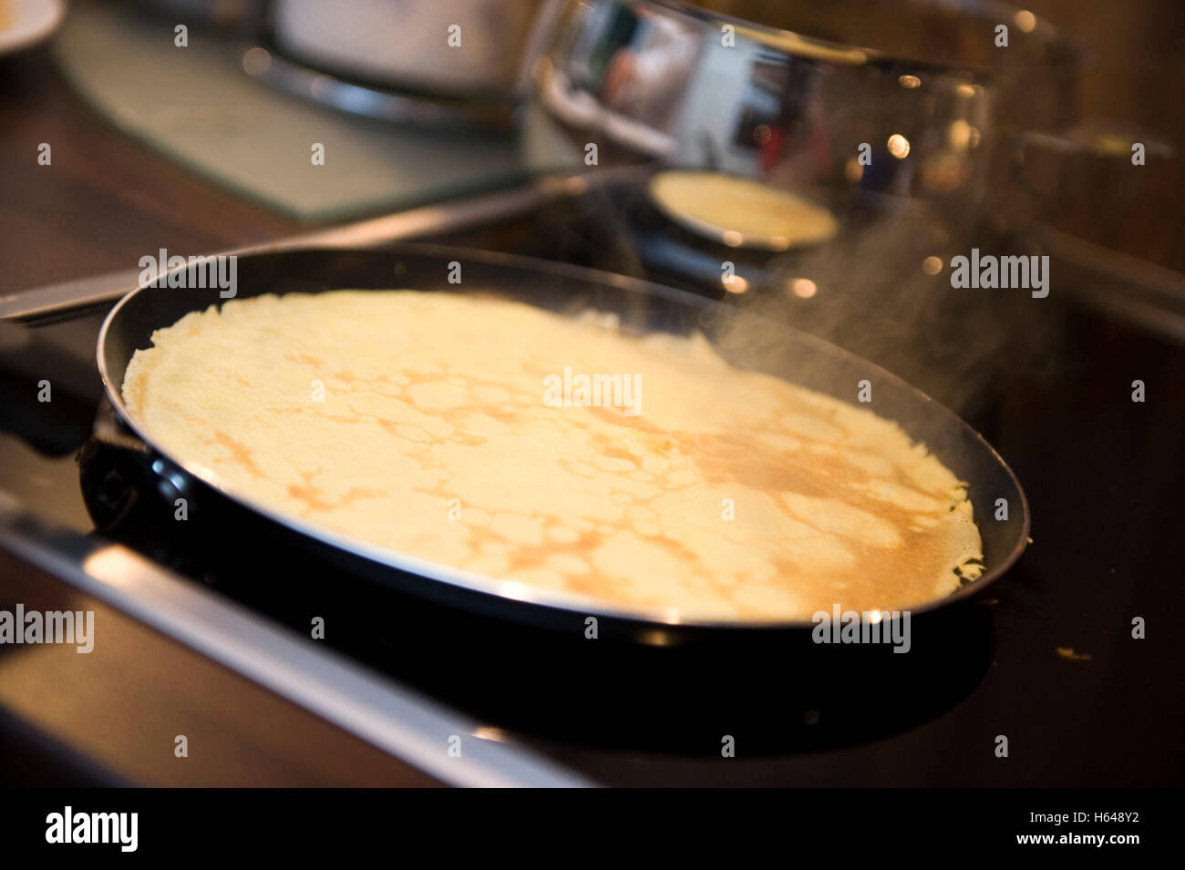 Making crepes in the pan Stock Photo - Alamy