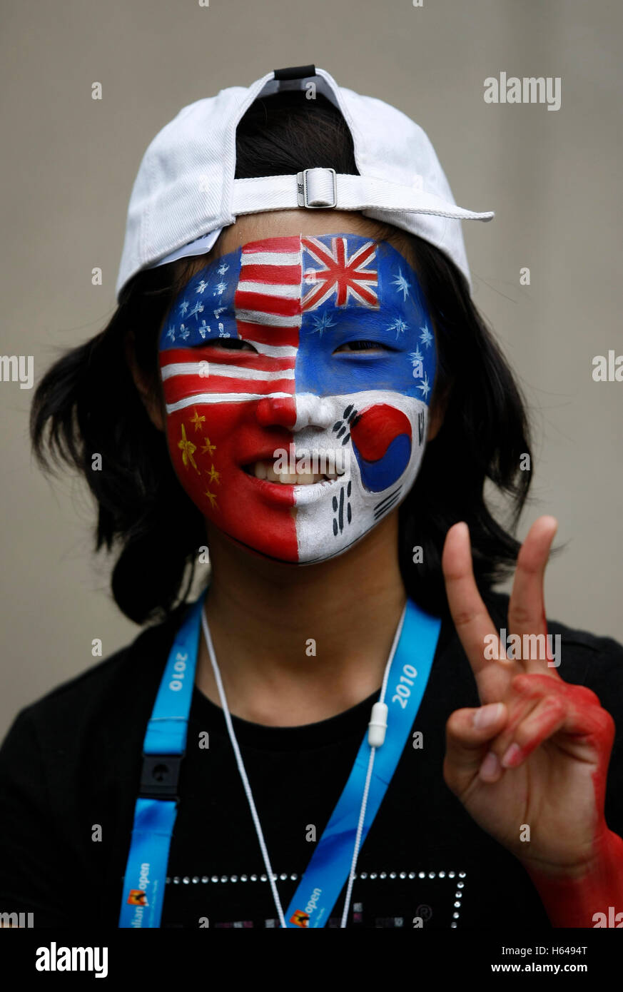 Young fan with face paint in the national colors of USA, Australia ...