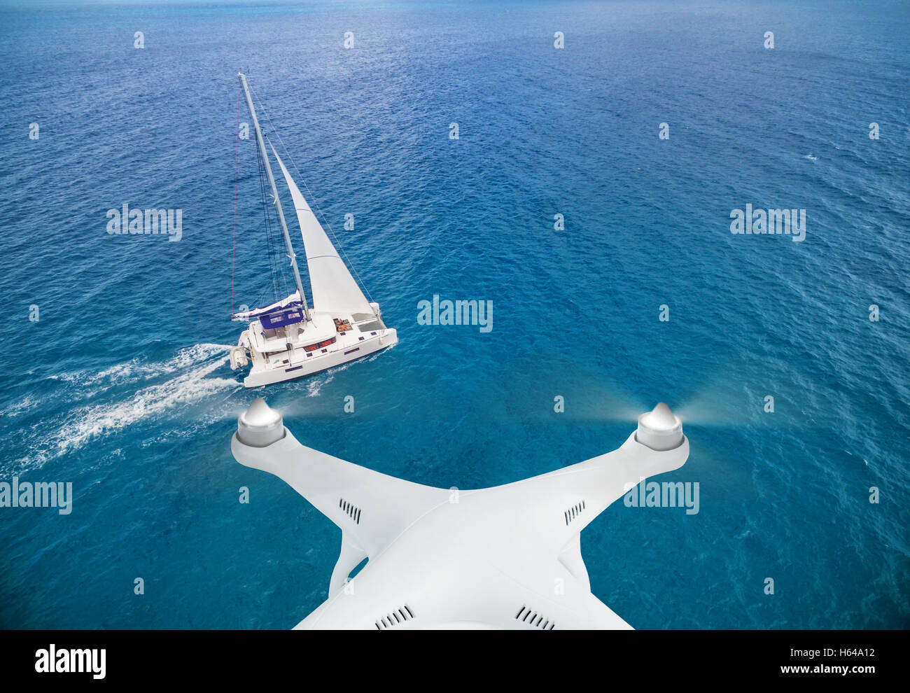 Drone flying above catamaran yacht on open ocean Stock Photo - Alamy