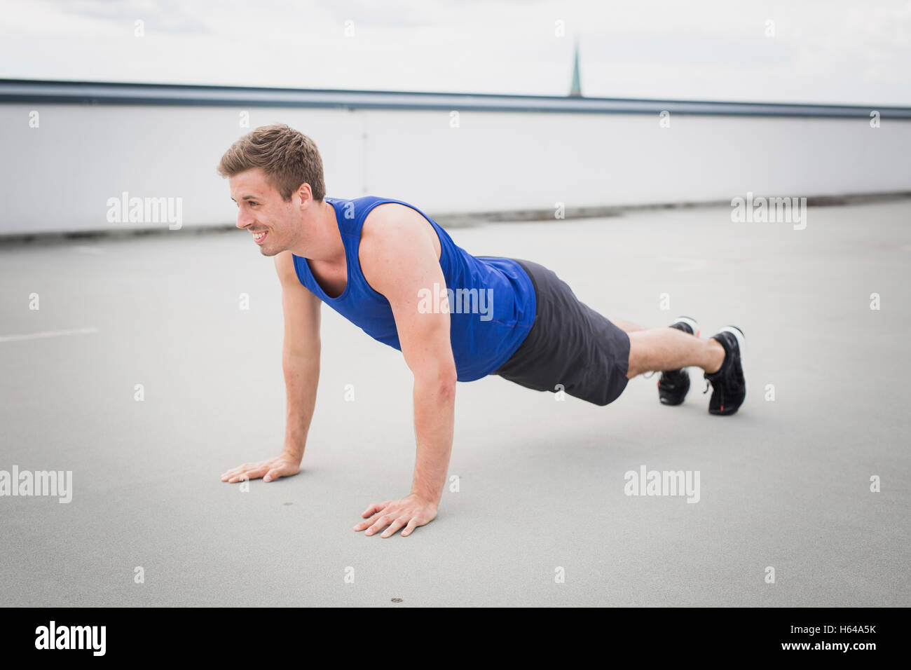 Man doing push ups outdoor Stock Photo - Alamy