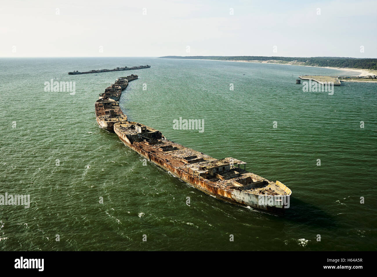 USA, Aerial photograph of sunken ships forming a bulkhead along the ...