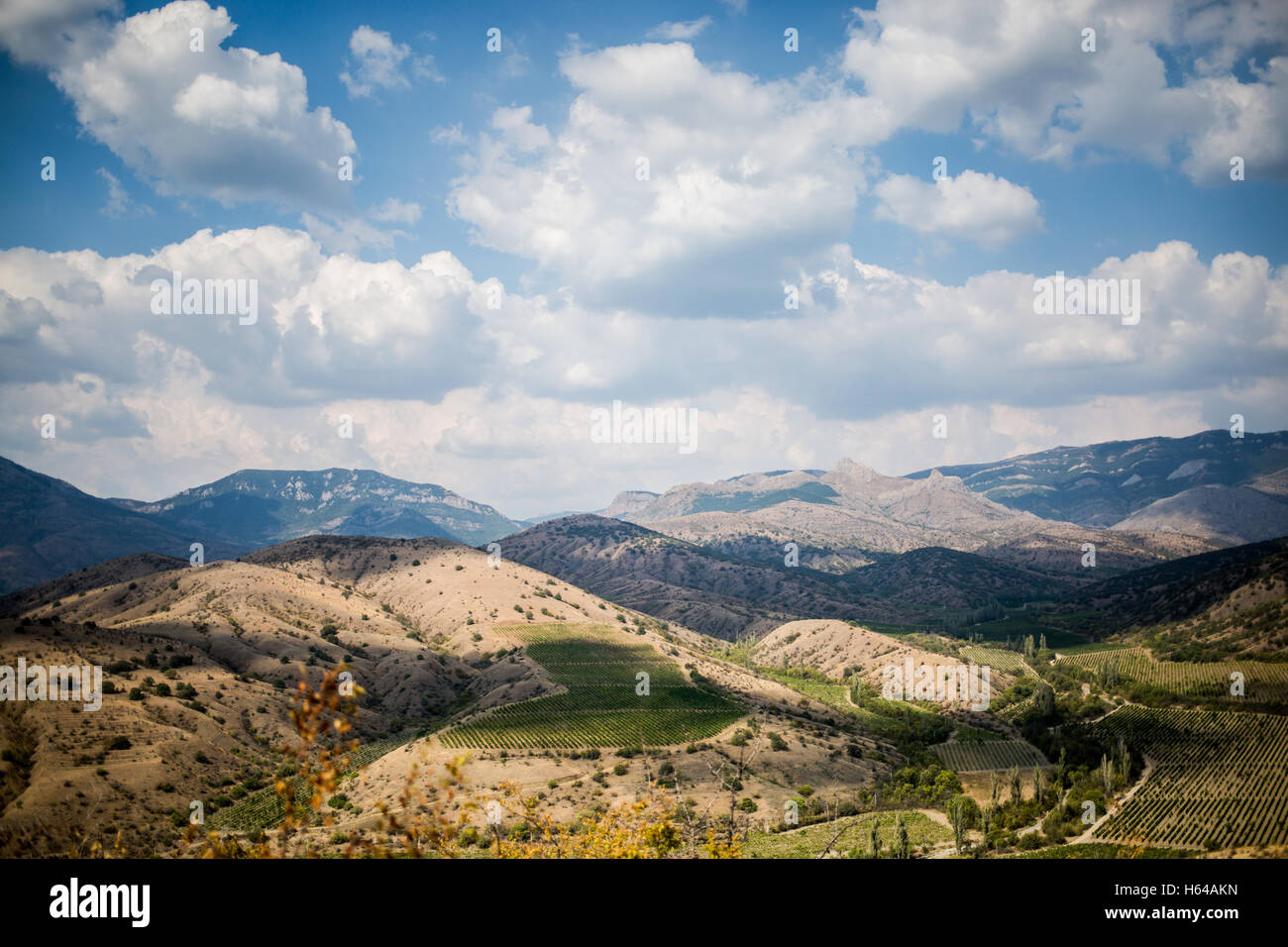 Panoramic scenic views of hilly valley and blue cloudy sky Stock Photo ...