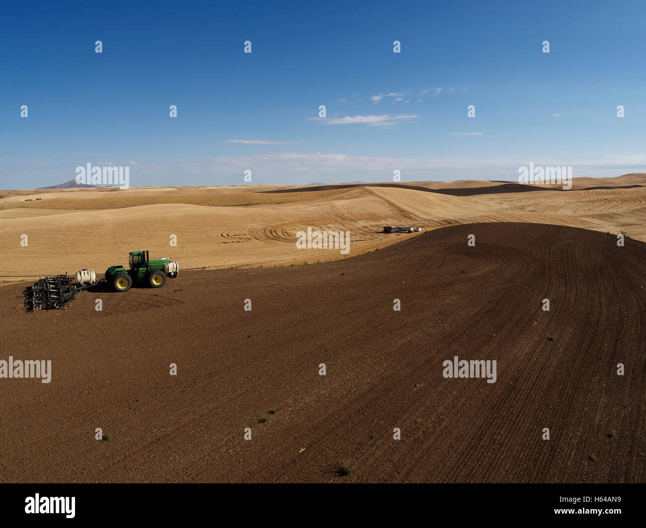 USA, Washington State, Palouse hills, wheat field and tractor Stock ...