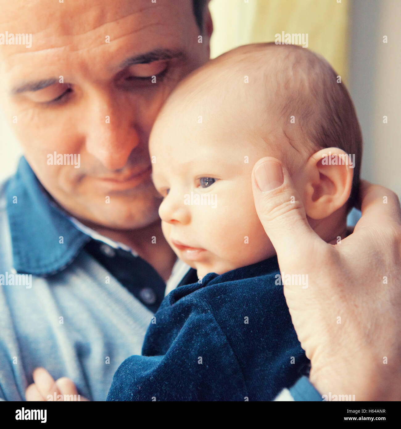 Grandfather holding his baby grandson Stock Photo - Alamy