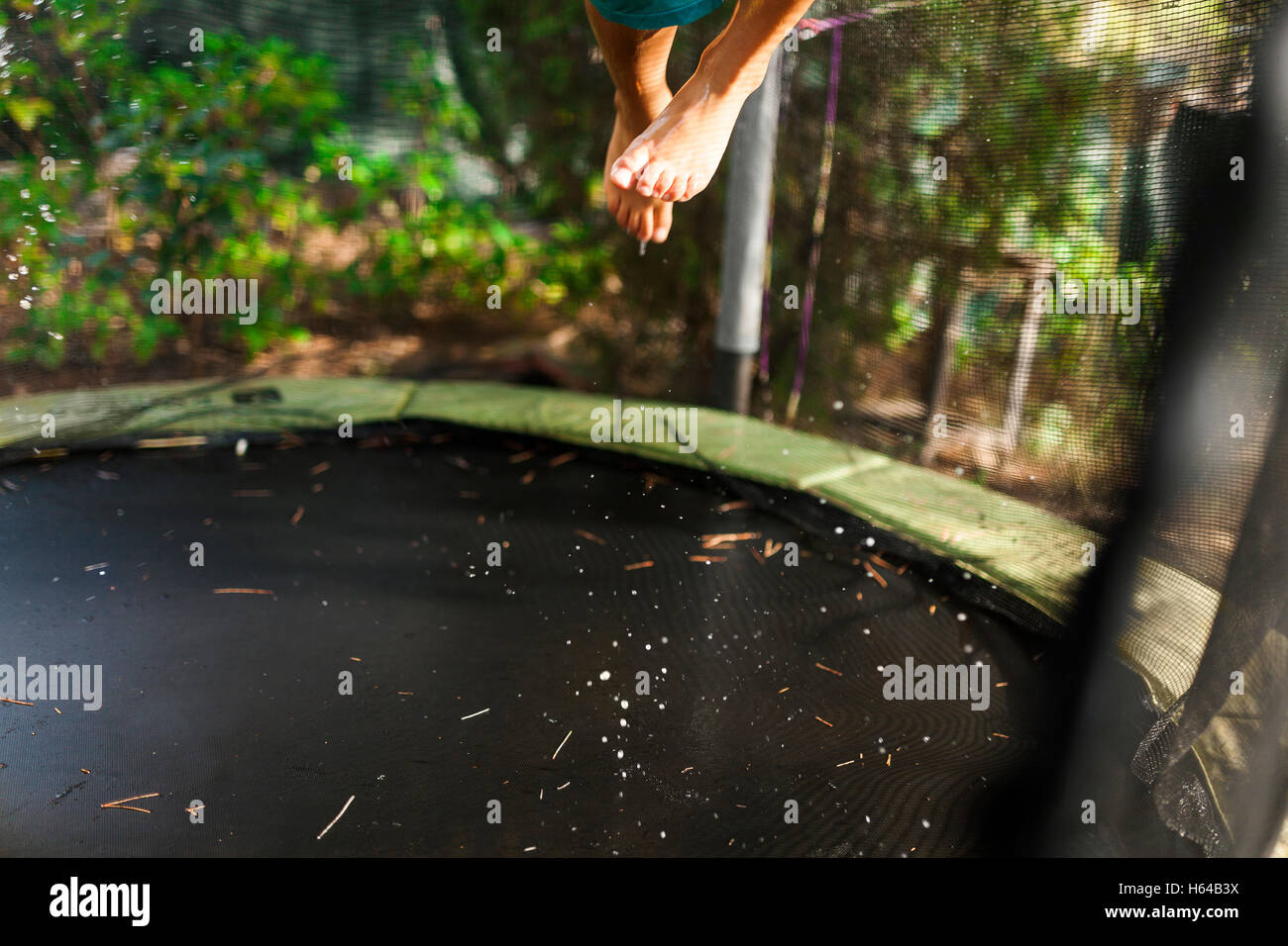 Feet on trampoline hi-res stock photography and images - Alamy