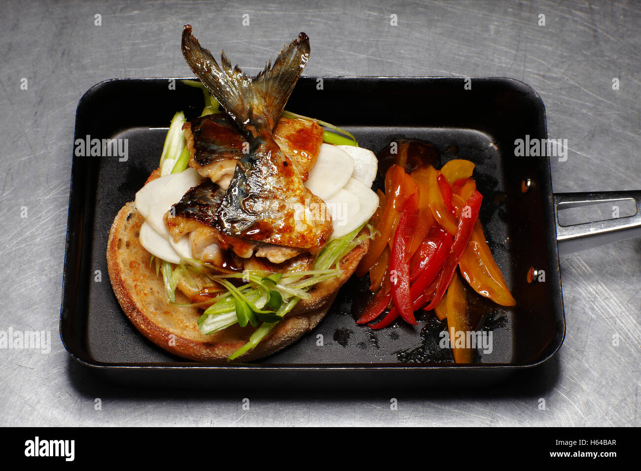 Mackerel burger with bell peppers and spring onions Stock Photo - Alamy