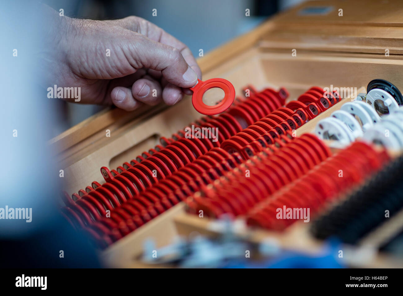 Optometrist choosing eye test lenses, close up Stock Photo - Alamy