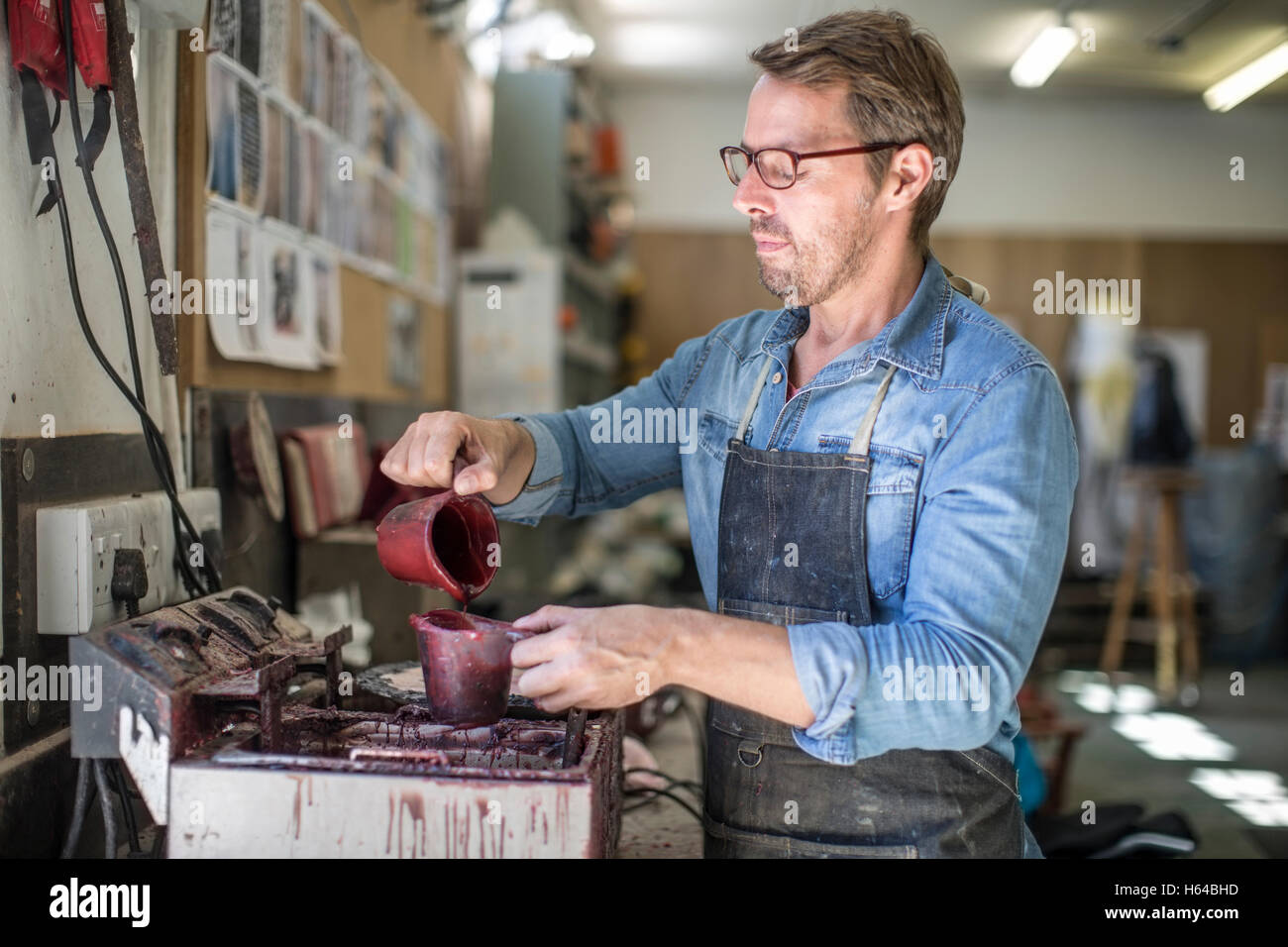 Artist mixing sculpting mould wax Stock Photo - Alamy