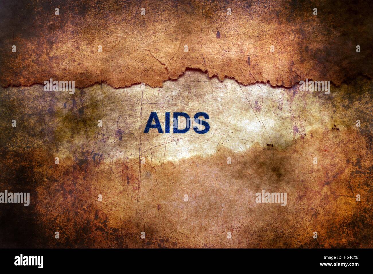 Aids text on torn paper grunge concept Stock Photo - Alamy