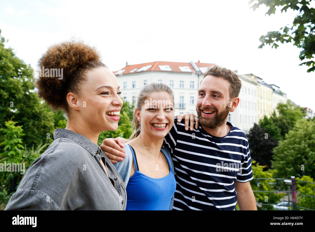 Three happy friends outdoors Stock Photo - Alamy