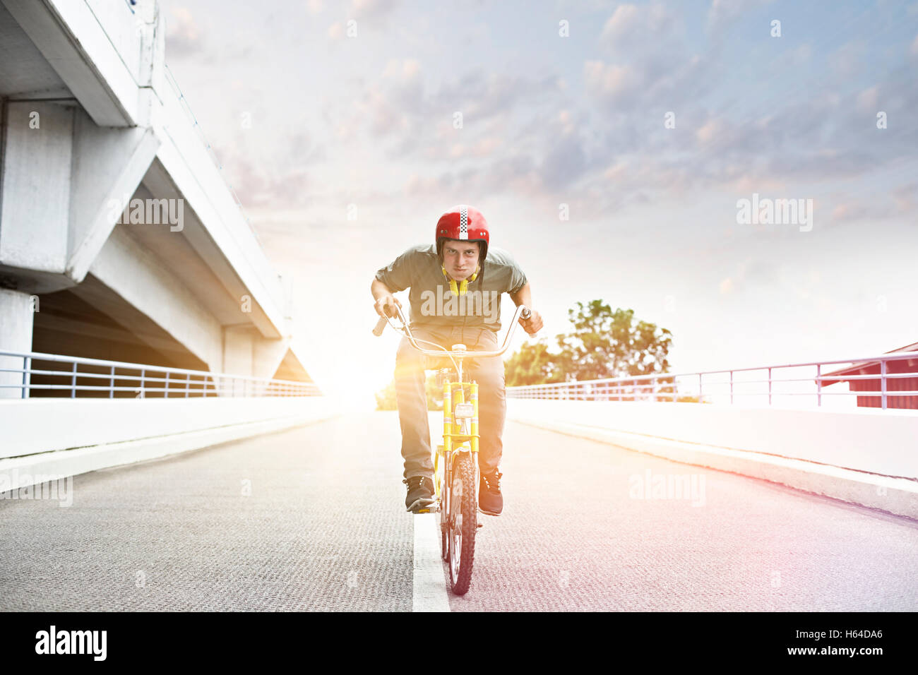 Teenage boy speeding up on bicycle Stock Photo - Alamy