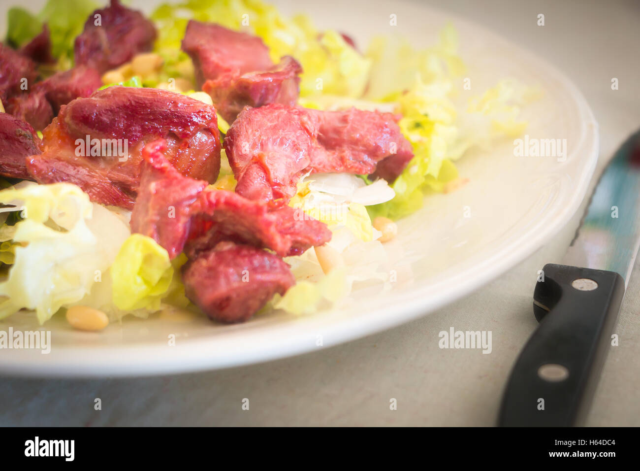 gizzards plate with salad on a table prepared Stock Photo - Alamy