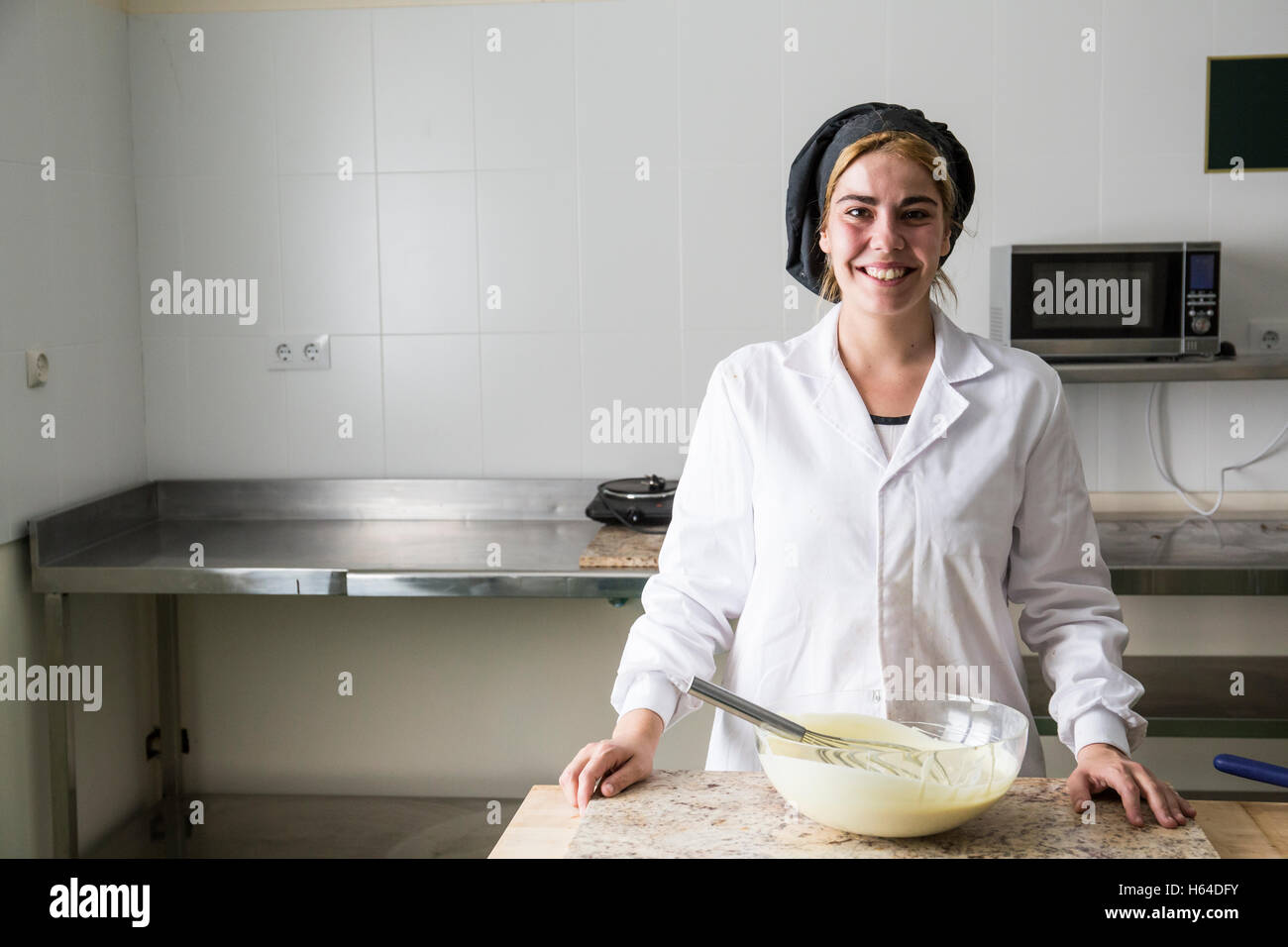 Portrait of a smiling female chocolatier Stock Photo - Alamy