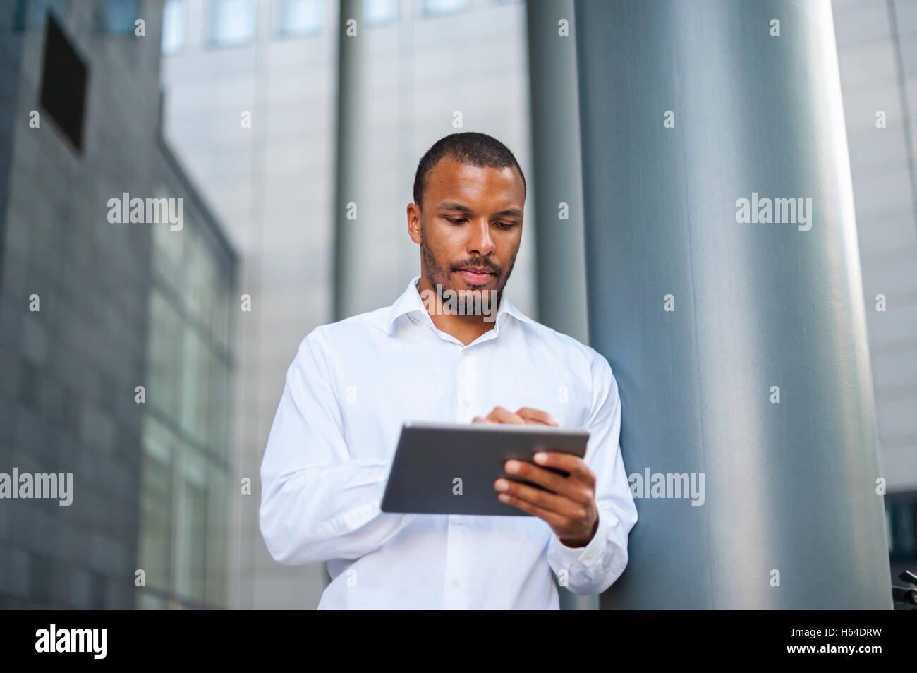 Businessman using tablet Stock Photo - Alamy Businessman using tablet Stock Photo - Alamy