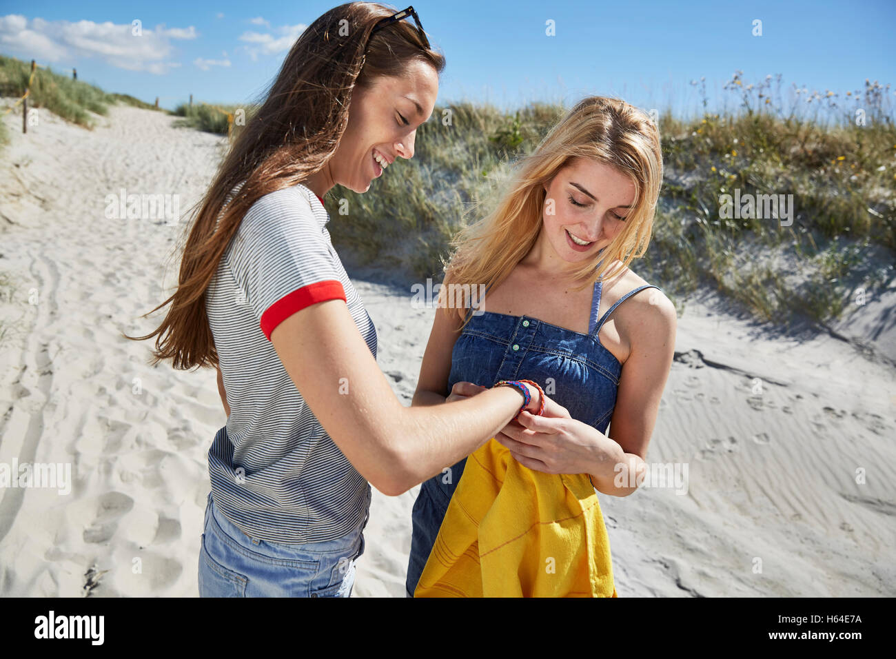 Two happy female friends on the beach Stock Photo - Alamy