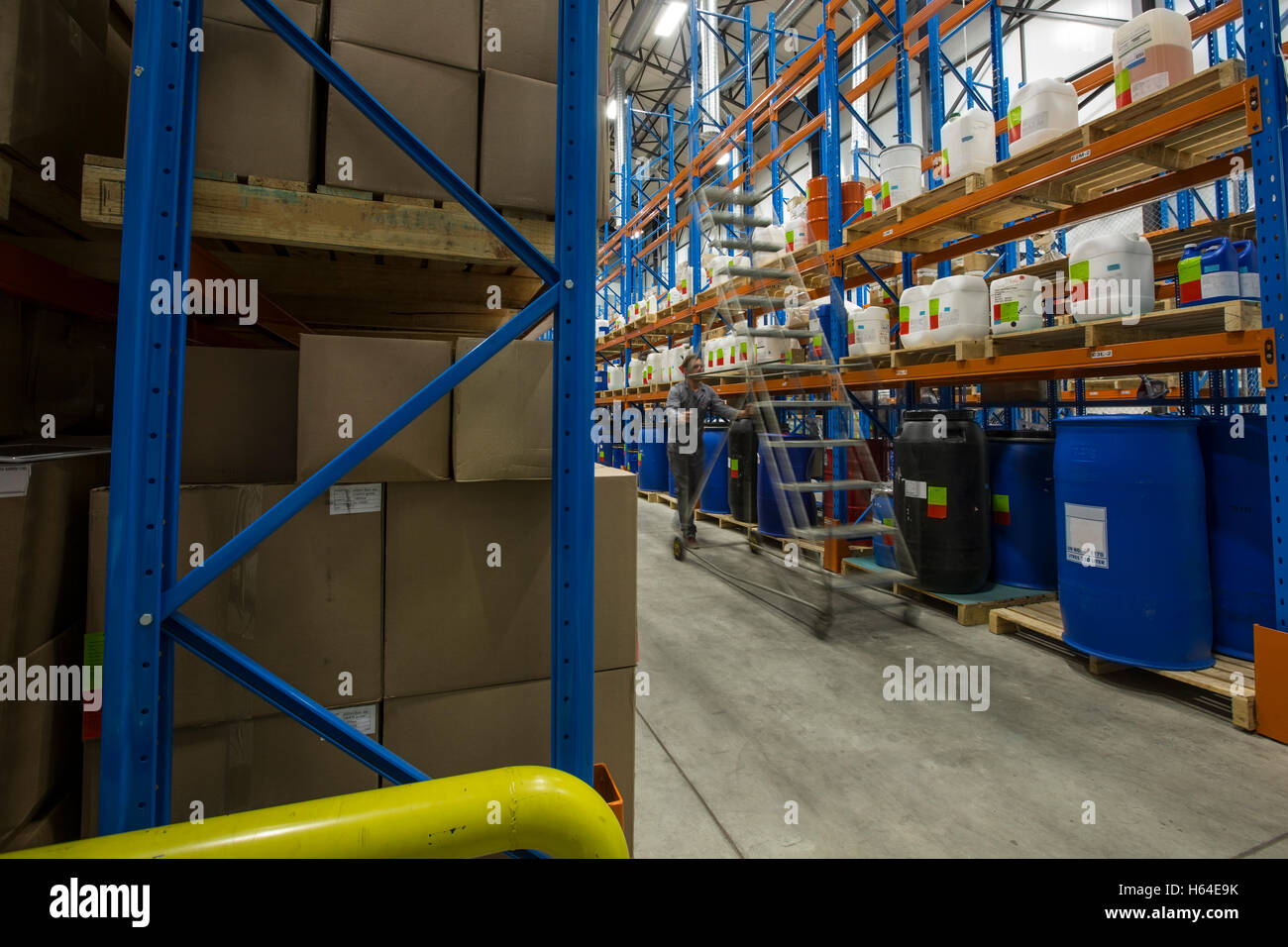 Warehouseman working in storehouse Stock Photo - Alamy